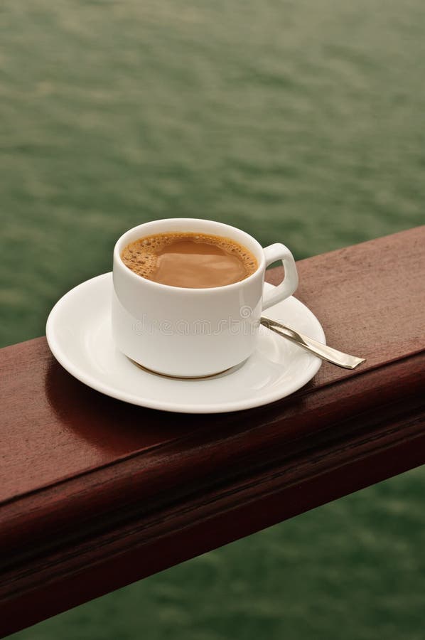 Coffee mug on the deck stock photo. Image of blueberries - 57886554