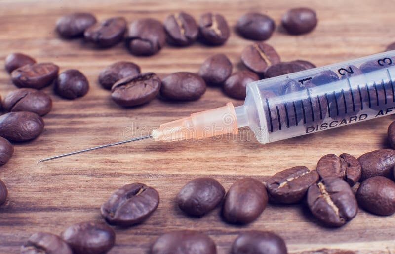 Coffee Dependence Syringe with Beans of Coffee Stock Image - Image of ...