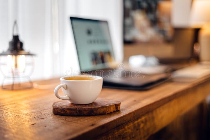 Coffee on desk at home stock image. Image of business - 266641803