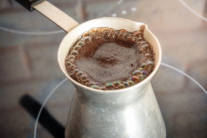 Coffee Drink is Boiling in a Pot on the Stove Stock Image - Image of ...
