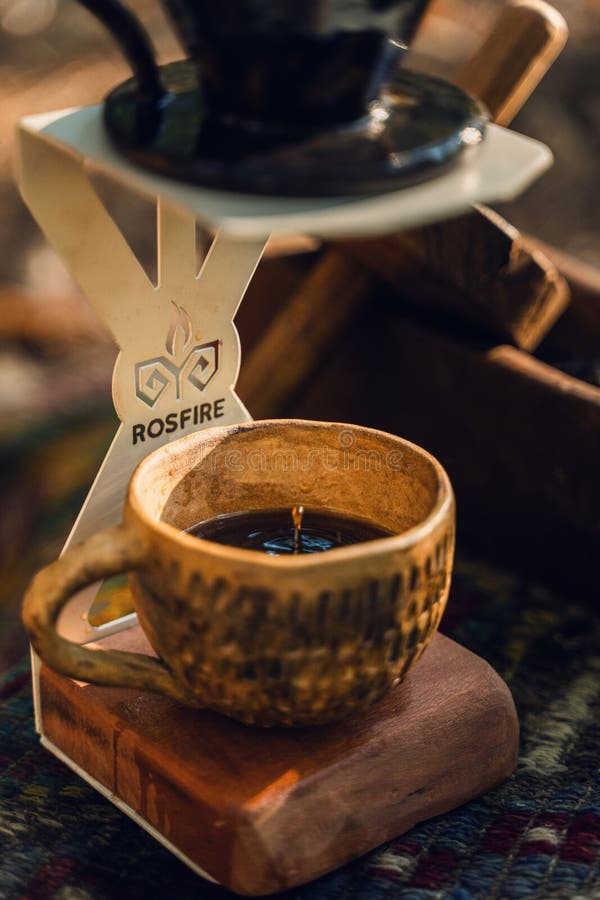 Coffee Drip into Ceramic Mug with Rosfire Stand Stock Photo - Image of ...