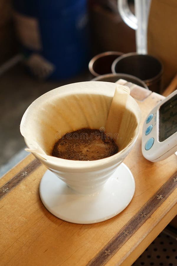 Coffee in Dripping Filter on Stand Stock Photo - Image of hand ...