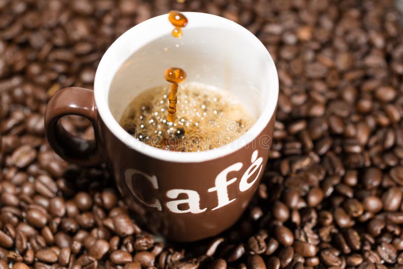 Coffee Drops are Falling into a Cup Stock Image - Image of beverage ...