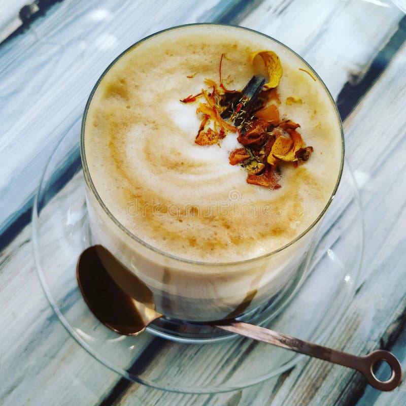 Coffee with edible flowers stock photo. Image of dairy - 207951734