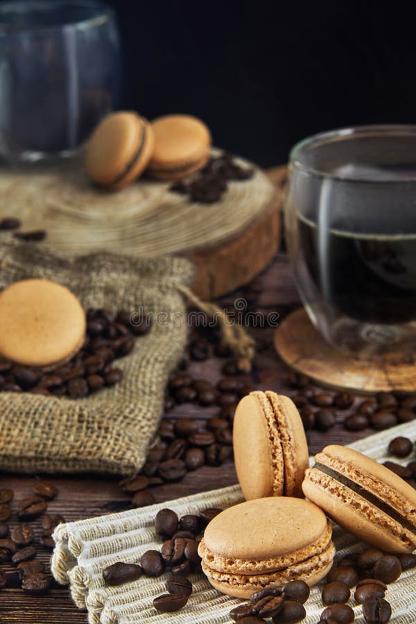 Coffee Flavor Macarons with Coffee Beans and Cups of Coffee Stock Photo ...