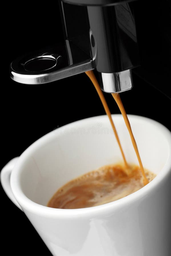 Coffee Flows Out of the Coffee Machine. Stock Photo - Image of ...
