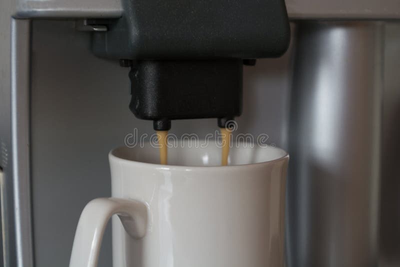 Coffee Flows Out of the Coffee Machine Stock Photo - Image of brown ...