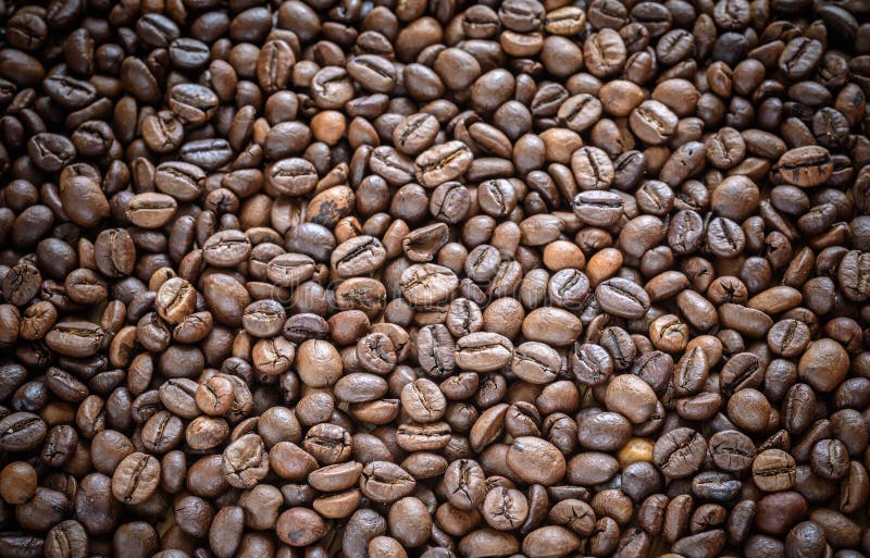 Coffee Grains on Grunge Wooden Background Stock Photo - Image of ...