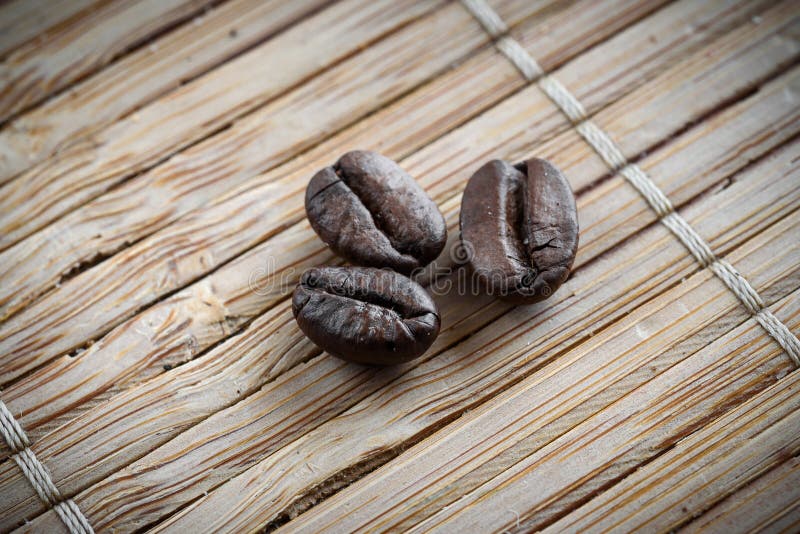 Coffee Grains on Grunge Wooden Background Stock Photo - Image of ...