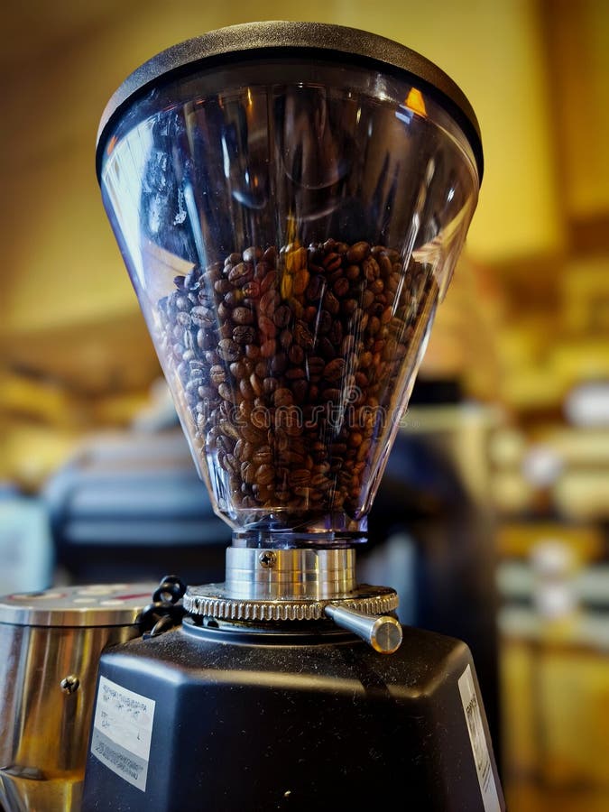 A Coffee Grinder with a Large Amount of Coffee Beans Inside Stock Photo ...