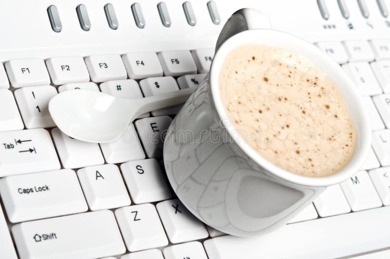 Coffee on keyboard stock photo. Image of break, espresso - 20696298