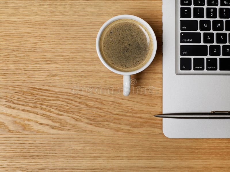Coffee and laptop on desk stock image. Image of office - 61855403