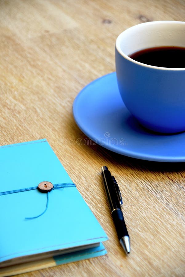 Cup of Coffee and a Notebook on a Table Stock Photo - Image of coffee ...