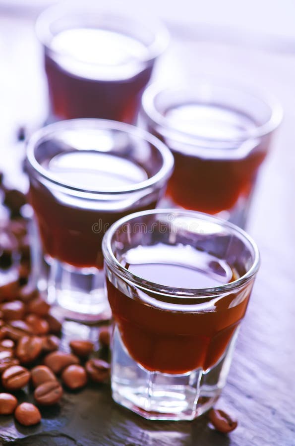 Coffee Liquor is Poured from a Bottle into a Glass Stock Image - Image ...