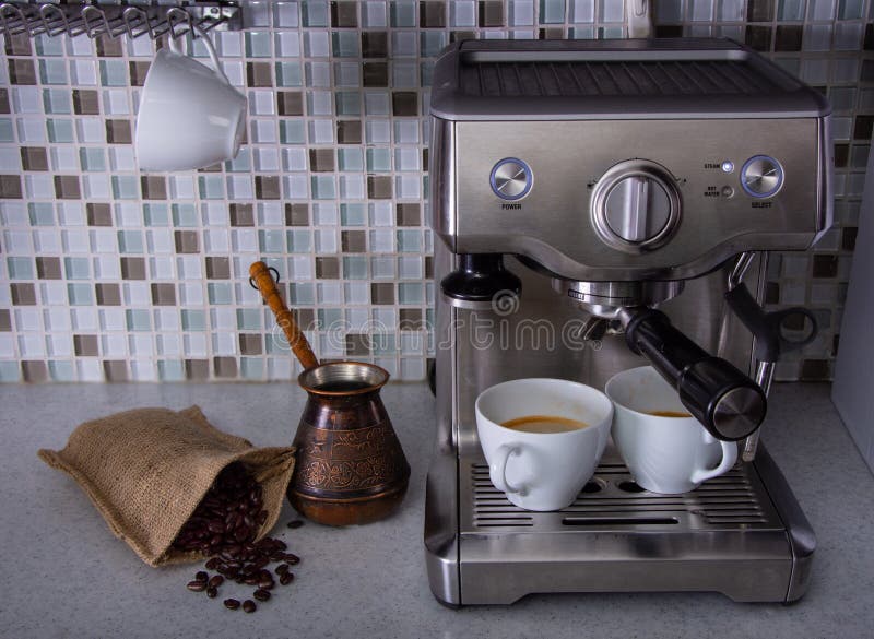 Coffee Machine Brewing Fresh Coffee into Coffee Cups Stock Photo ...