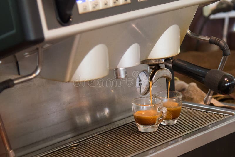 Coffee Machine Brewing a Coffee with Measuring Cup by Barista in Coffee ...