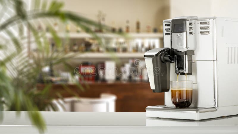 Coffee Machine on a Kitchen Cabinet in a Bright Warm Kitchen Interior ...