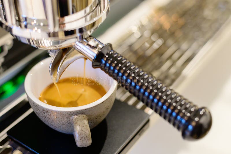 Coffee Machine with Stream Coffee Pouring in the Cup Stock Photo ...