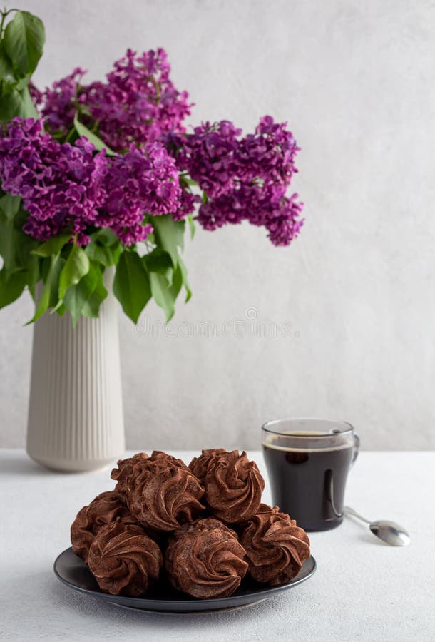 Coffee Marshmallows on a Light Background in a Plate, in the Background ... Coffee Marshmallows on a Light Background in a Plate, in the Background ...