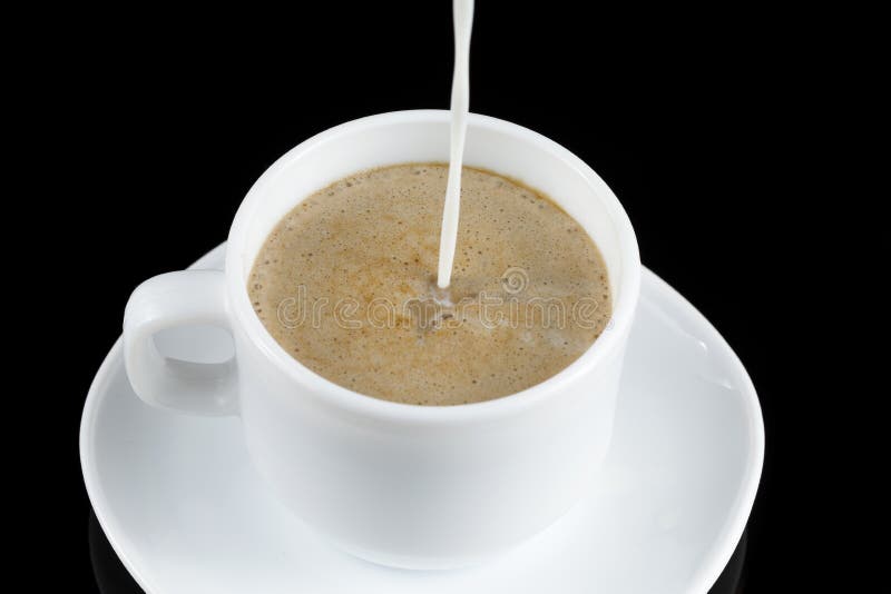 Coffee with Milk. Milk is Poured into a Cup with Coffee Stock Image ...