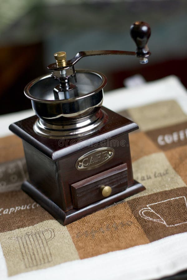 Coffee mill on the table stock photo. Image of pile, close - 18931236
