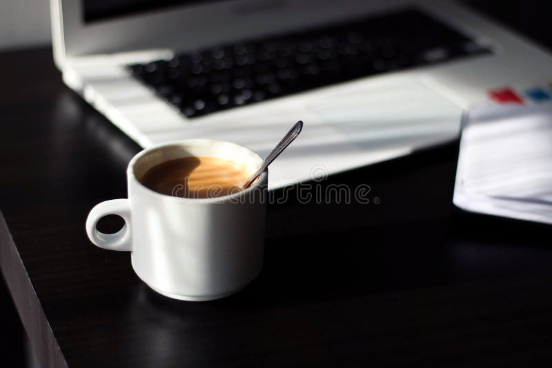 Coffee Mug on a Desk, with a Laptop and a Notebook Stock Photo - Image ...