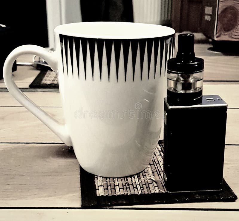 Coffee Mug and a Vape stock photo. Image of vape, replacement - 126661402