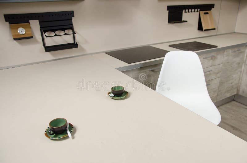Coffee Mugs and Saucers on a Table Combined with a Countertop in a ...