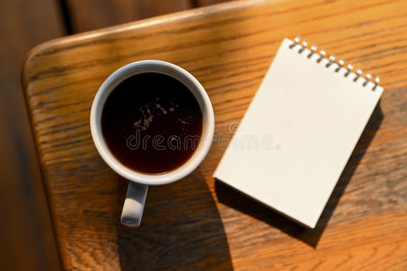 Coffee and a Notebook on the Table, Top View Shot Stock Photo - Image ...