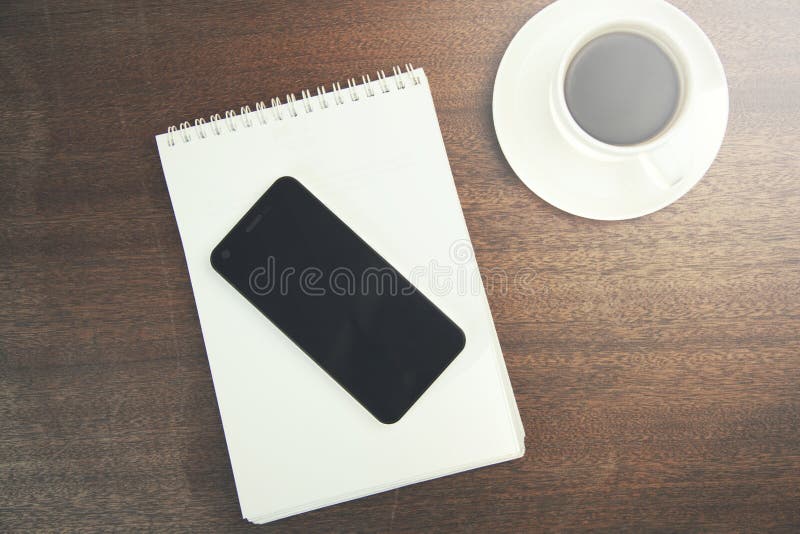 Coffee,notepad and phone stock photo. Image of notepad - 133834148