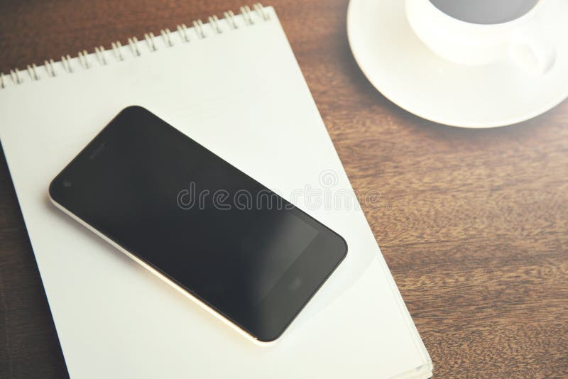 Coffee,notepad and phone stock photo. Image of table - 133834160