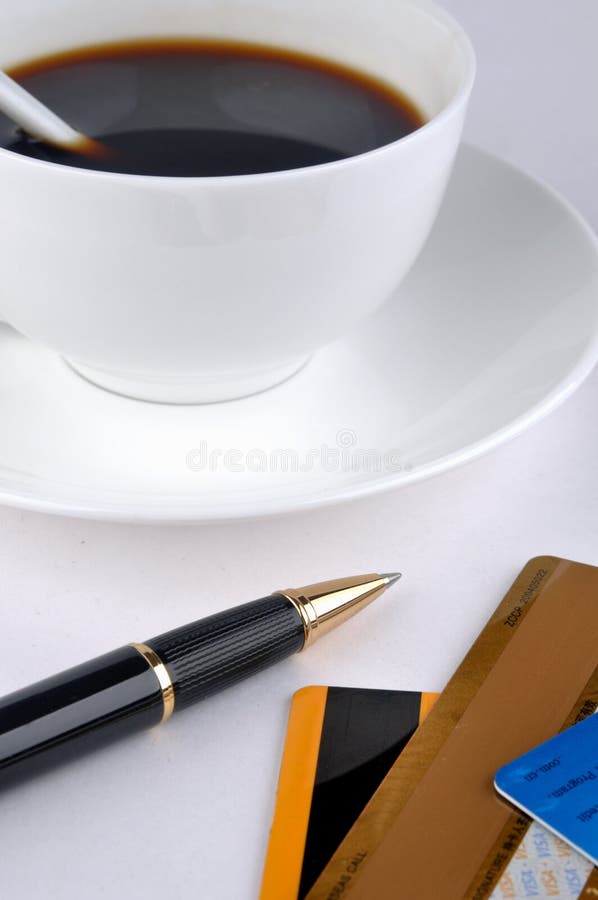 Coffee, pen and bank cards stock photo. Image of rest - 13519712