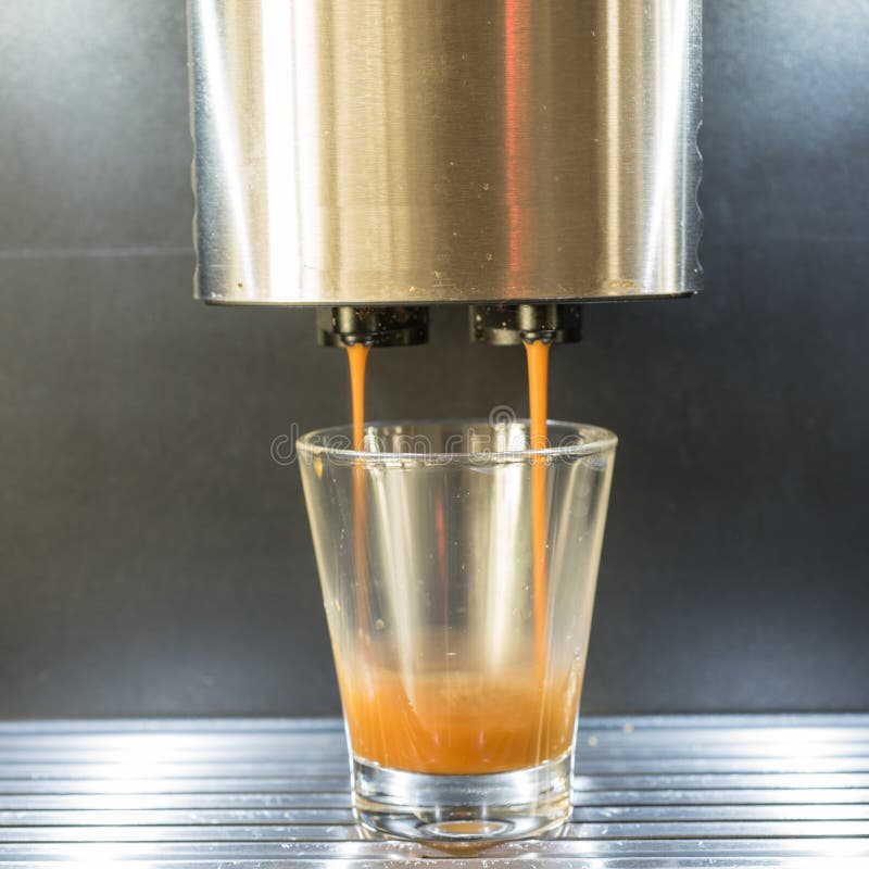 Coffee Poring Freshly Brewed from the Coffee Machine Stock Image ...