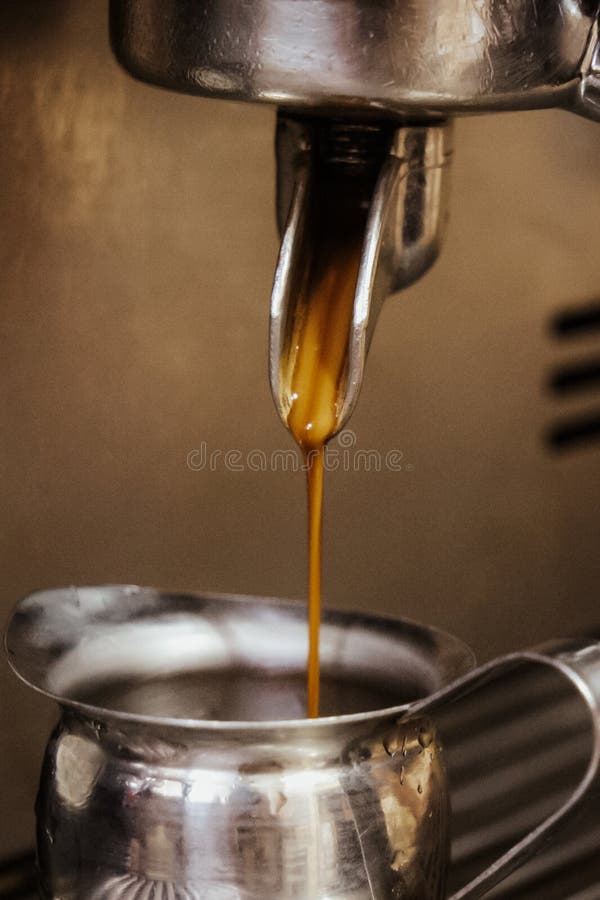 Coffee is Poured into a Metal Jug from a Coffee Machine Stock Image ...