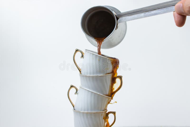 Coffee is Poured into a Coffee Cup. Coffee is Poured from a Turk Stock ...