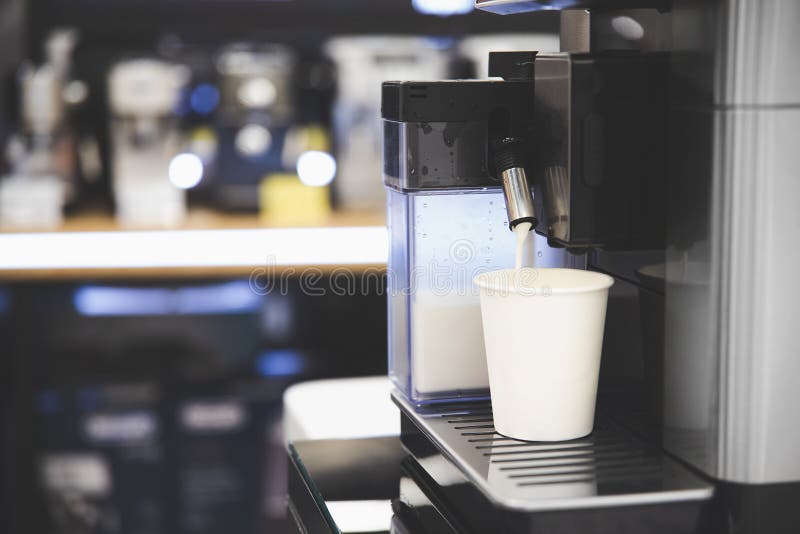 Coffee is Poured into a White Paper Cup from a Coffee Machine, Take ...