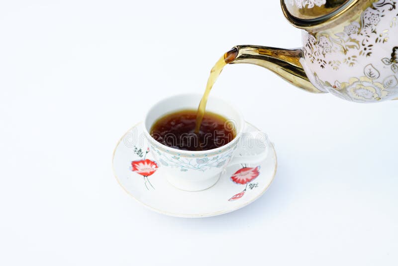 The Coffee is Pouring into the Cup from a Kettle. Stock Image - Image ...