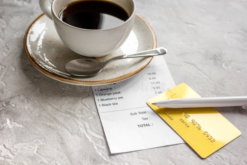 Coffee and Receipt Bill for Payment by Credit Card on Wooden Table ...