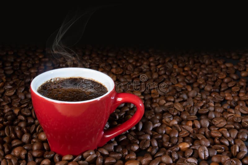 Coffee in a Red Cup with Steam on the Background of Coffee Beans Stock ...