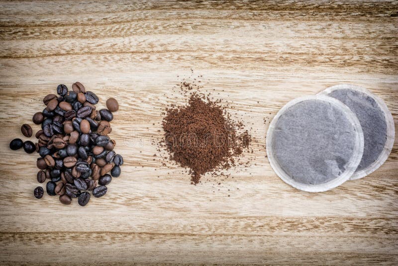Coffee on Rustic Wood Compared between Coffee Beans, Powder and Pads ...