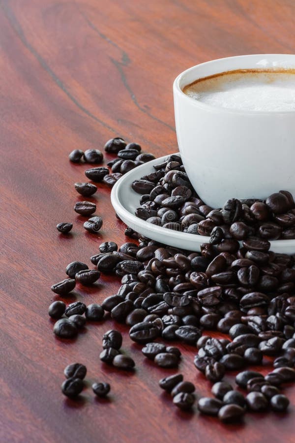 Coffee seed on wood table stock image. Image of crop - 32727853