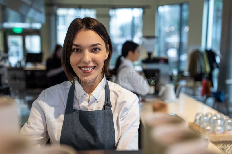 Coffee Shop Assistant Preparing Coffee in a Coffee Store Stock Image ...