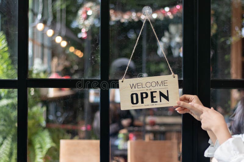 Coffee Shop Employees are Flipping Store Opening Sign Installed on ... Coffee Shop Employees are Flipping Store Opening Sign Installed on ...