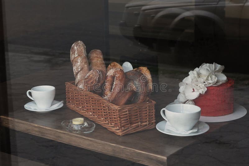 Coffee Shop Showcase with Sweet Pastries and Two Cups of Coffee Stock ...