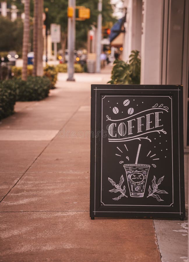 Coffee Sign on a Sidewalk Near Bushes Stock Image - Image of aroma ...