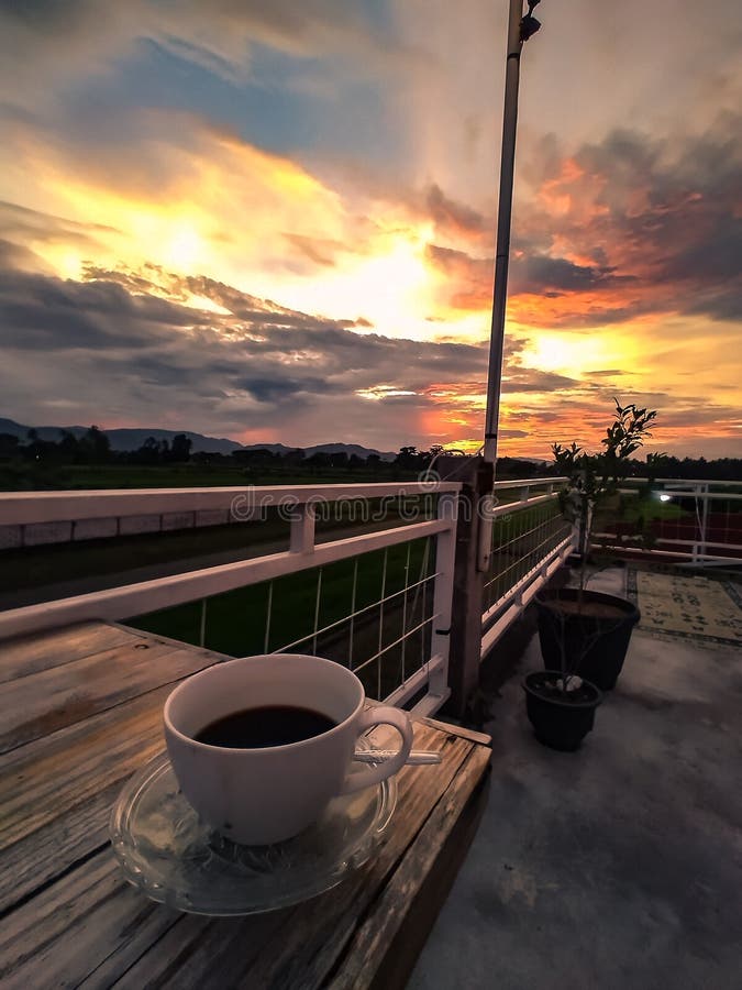 Coffee and sunset stock image. Image of cloud, sunlight - 243098473