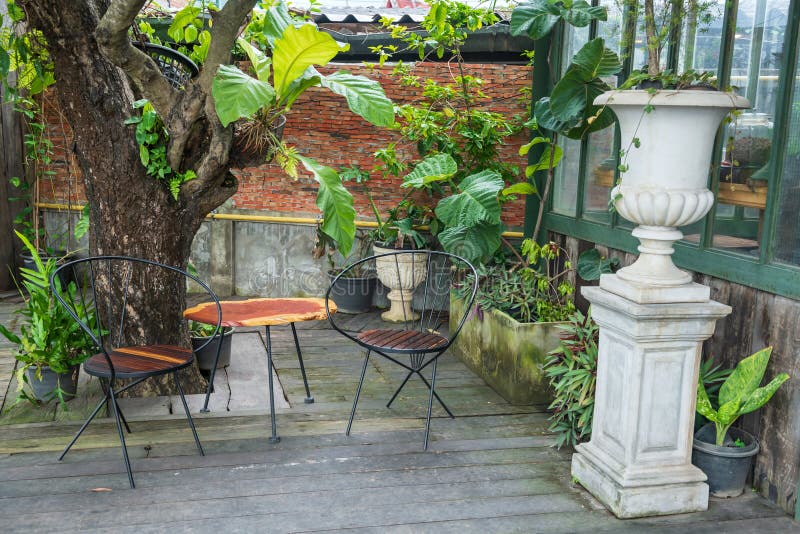 Coffee Table and Chairs Arranged in Backyard Garden of Coffee Cafe ...