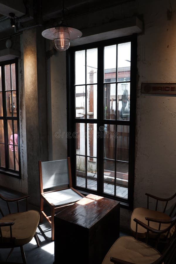 Coffee Table and Chairs Near Windows with Loft Style. Stock Photo ...