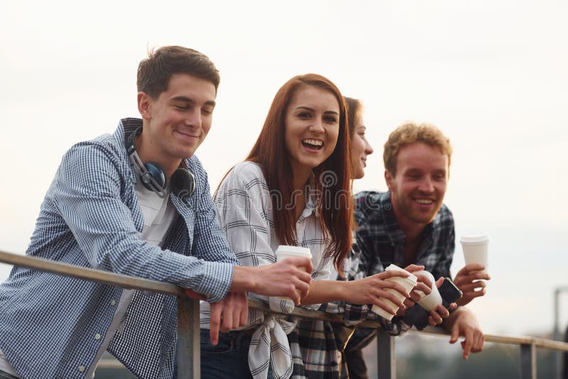 Coffee Time. Group of Young Cheerful Friends that is Outdoors Having ...