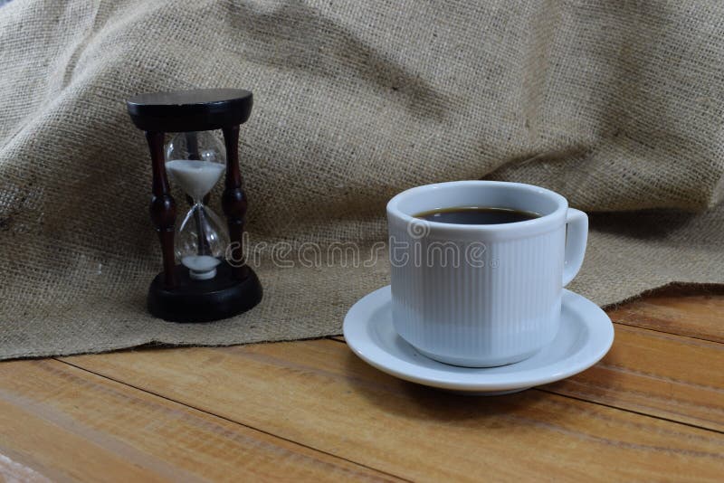 Coffee Time, Coffee Mug and an Hourglass on the Table Stock Image ...